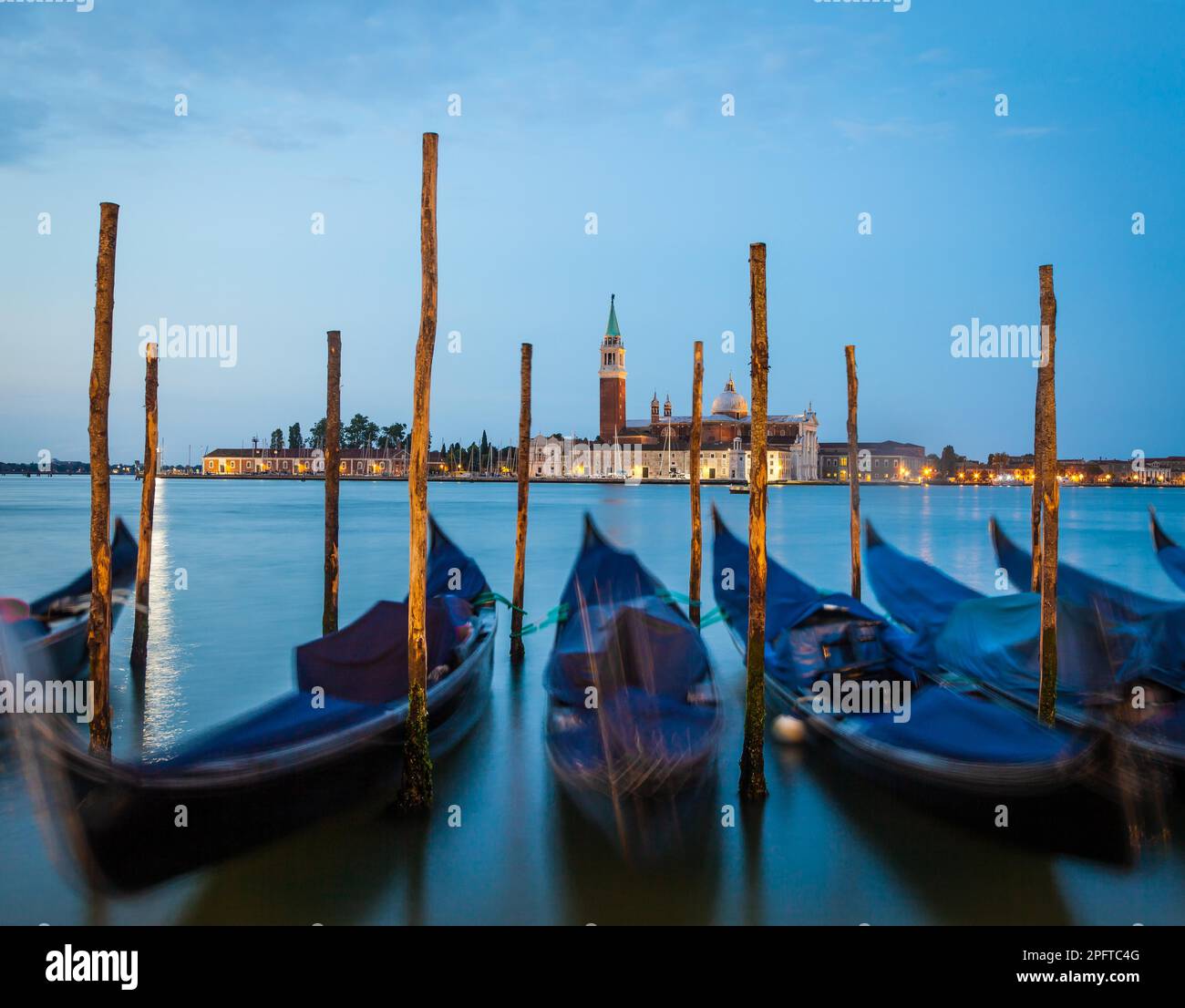 Moving Gondolas on Venice waterfront, San Giorgio Maggiore on the ...