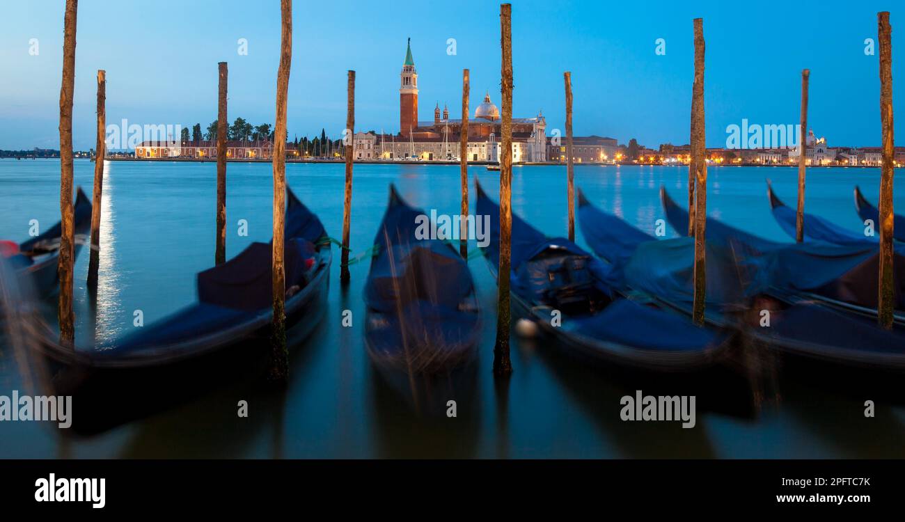 Moving Gondolas on Venice waterfront, San Giorgio Maggiore on the ...
