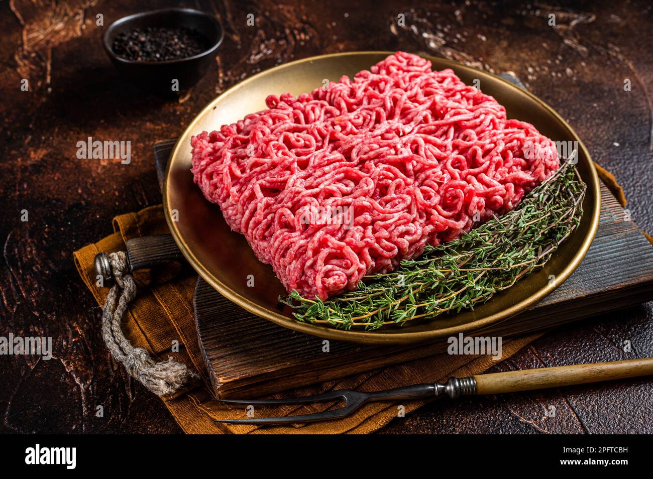 Fresh mutton lamb Mince Meat, raw ground meat. Dark background. Top ...