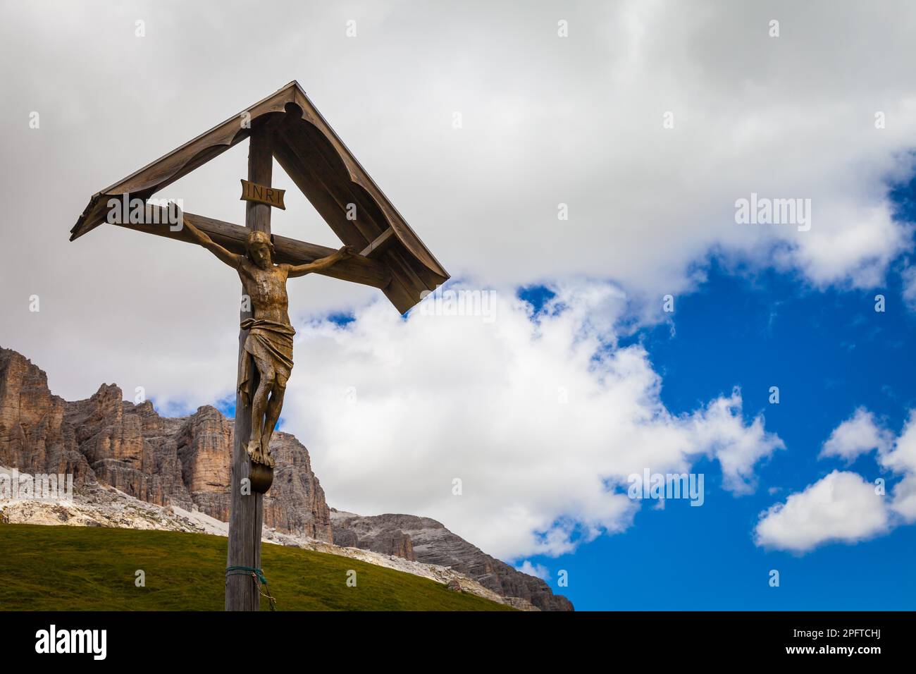 A 100 years old Crucifix, made of wood, tipical of Dolomity Region in ...