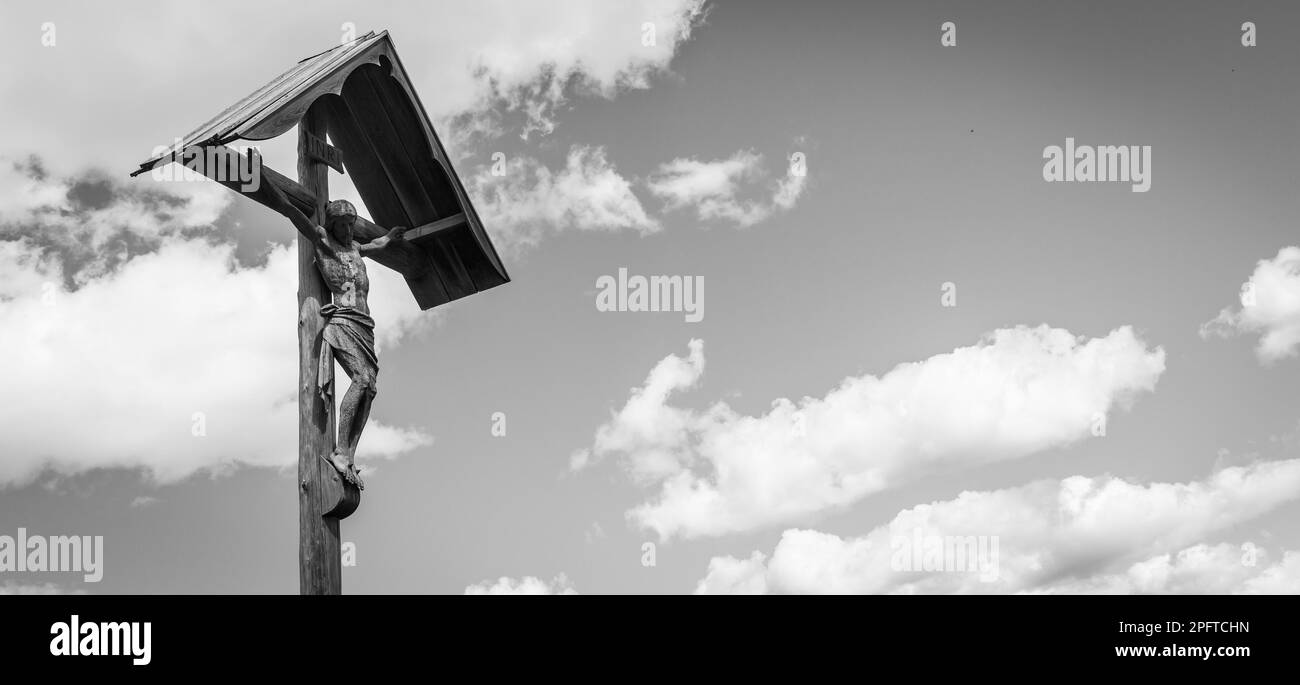 A 100 years old Crucifix, made of wood, tipical of Dolomity Region in ...
