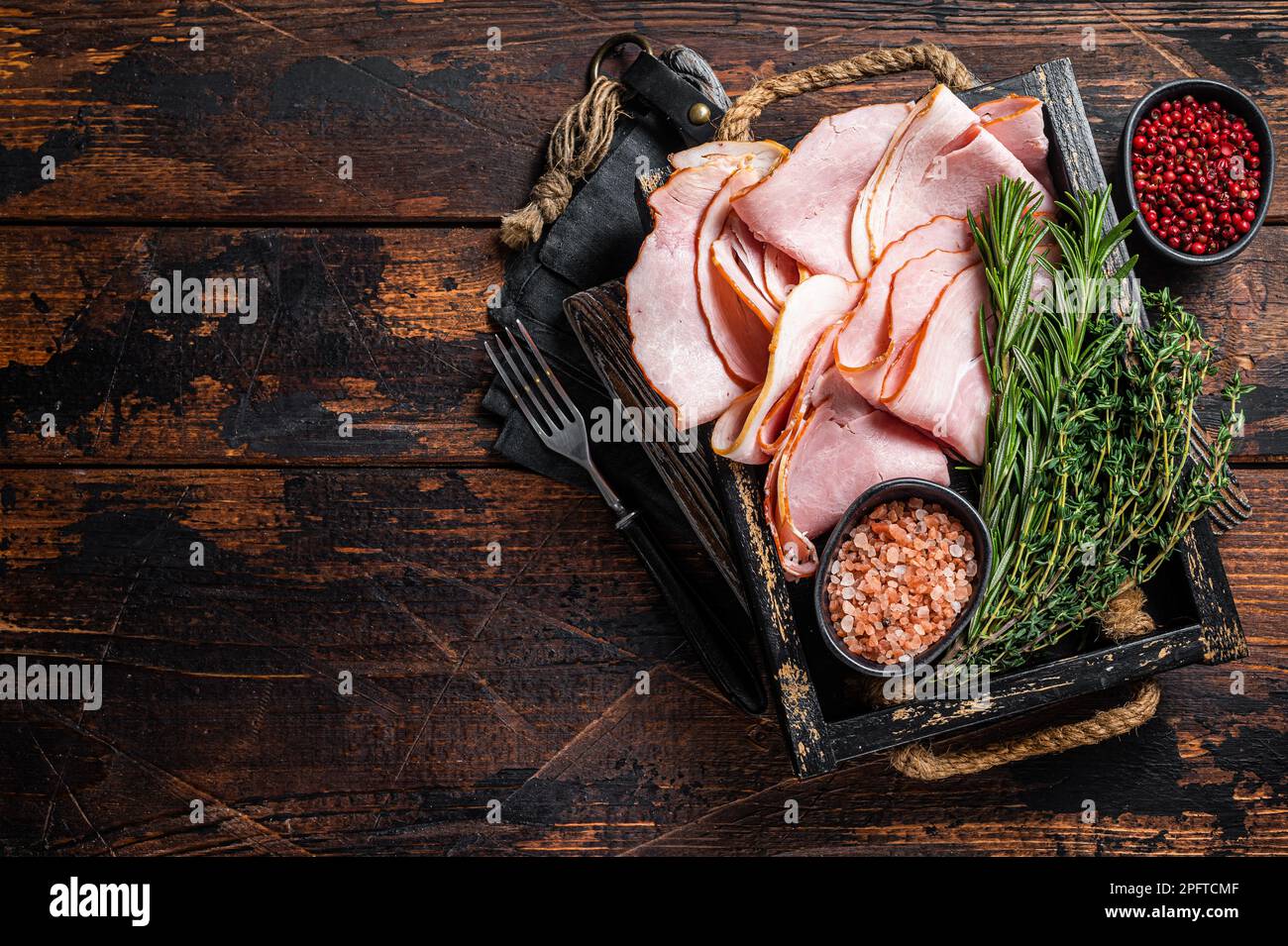 Italian Prosciutto cotto Ham slices in wooden tray with thyme and ...