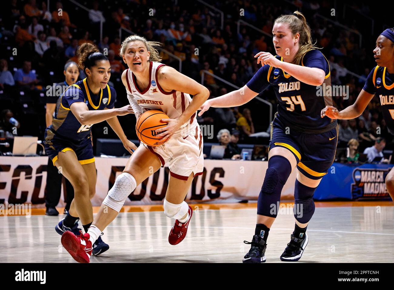 Iowa State guard Ashley Joens (24) drives between Toledo guard Jayda ...