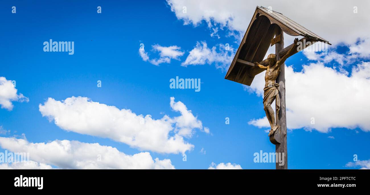 A 100 years old Crucifix, made of wood, tipical of Dolomity Region in ...