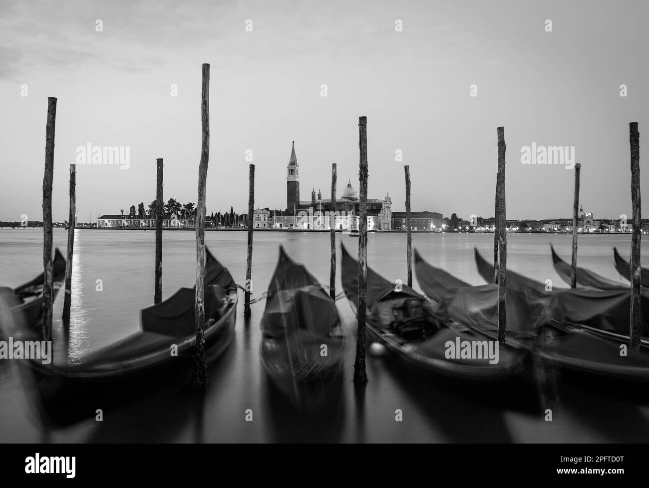 Moving Gondolas on Venice waterfront, San Giorgio Maggiore on the ...