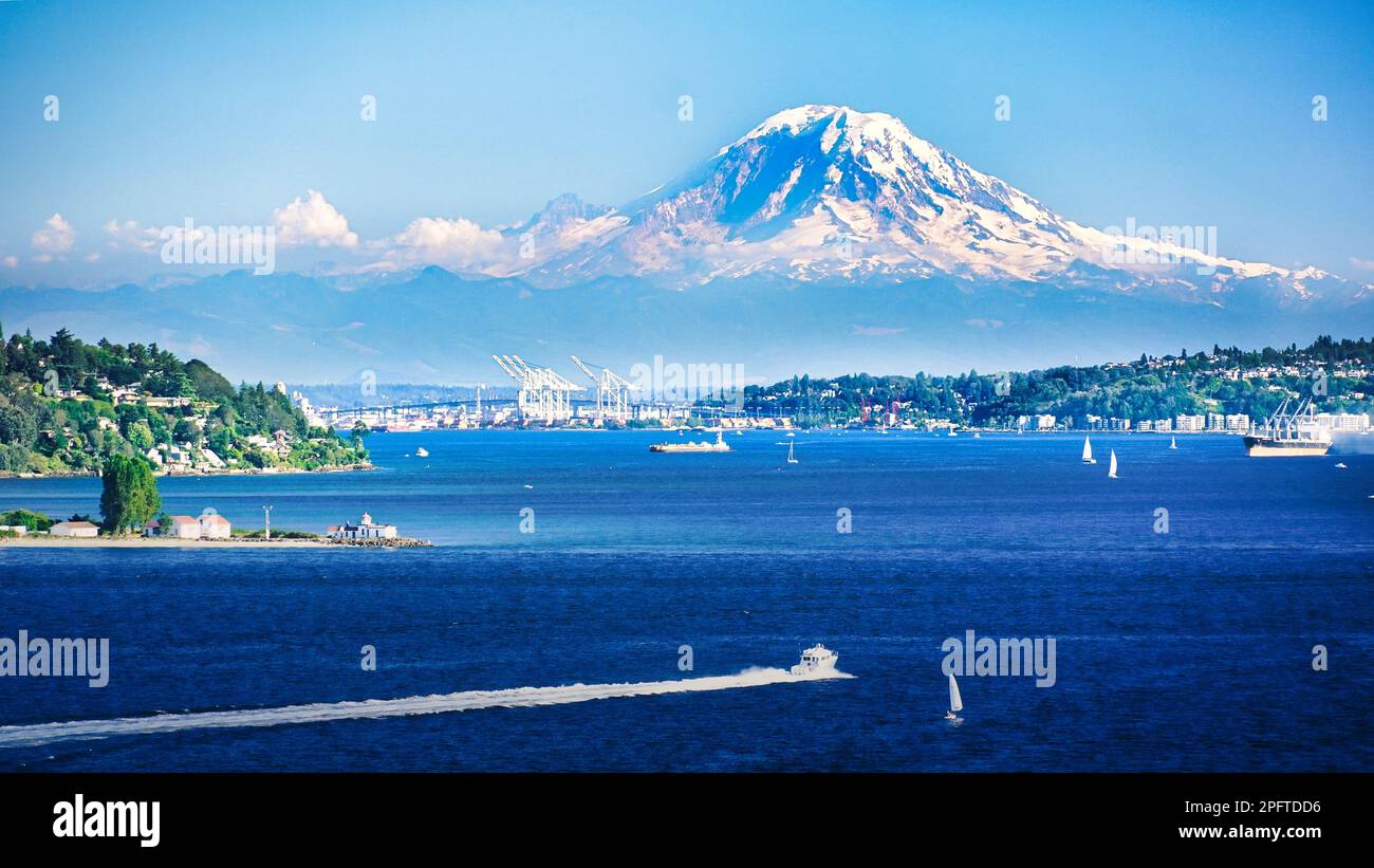 A majestic mountain looms in the background, while the city below ...