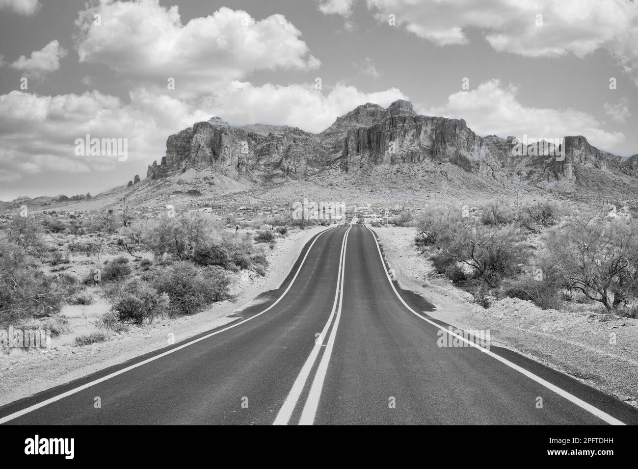 A barren road stretches out in an empty landscape Stock Photo - Alamy