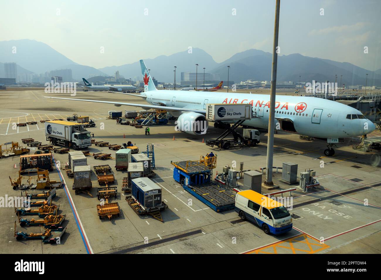 Hong Kong - March 1, 2023: Airplane at boarding gate jet bridge in Hong ...