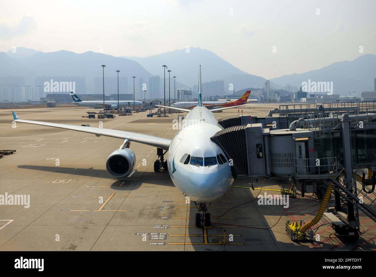 Hong Kong - March 1, 2023: Airplane at boarding gate jet bridge in Hong ...