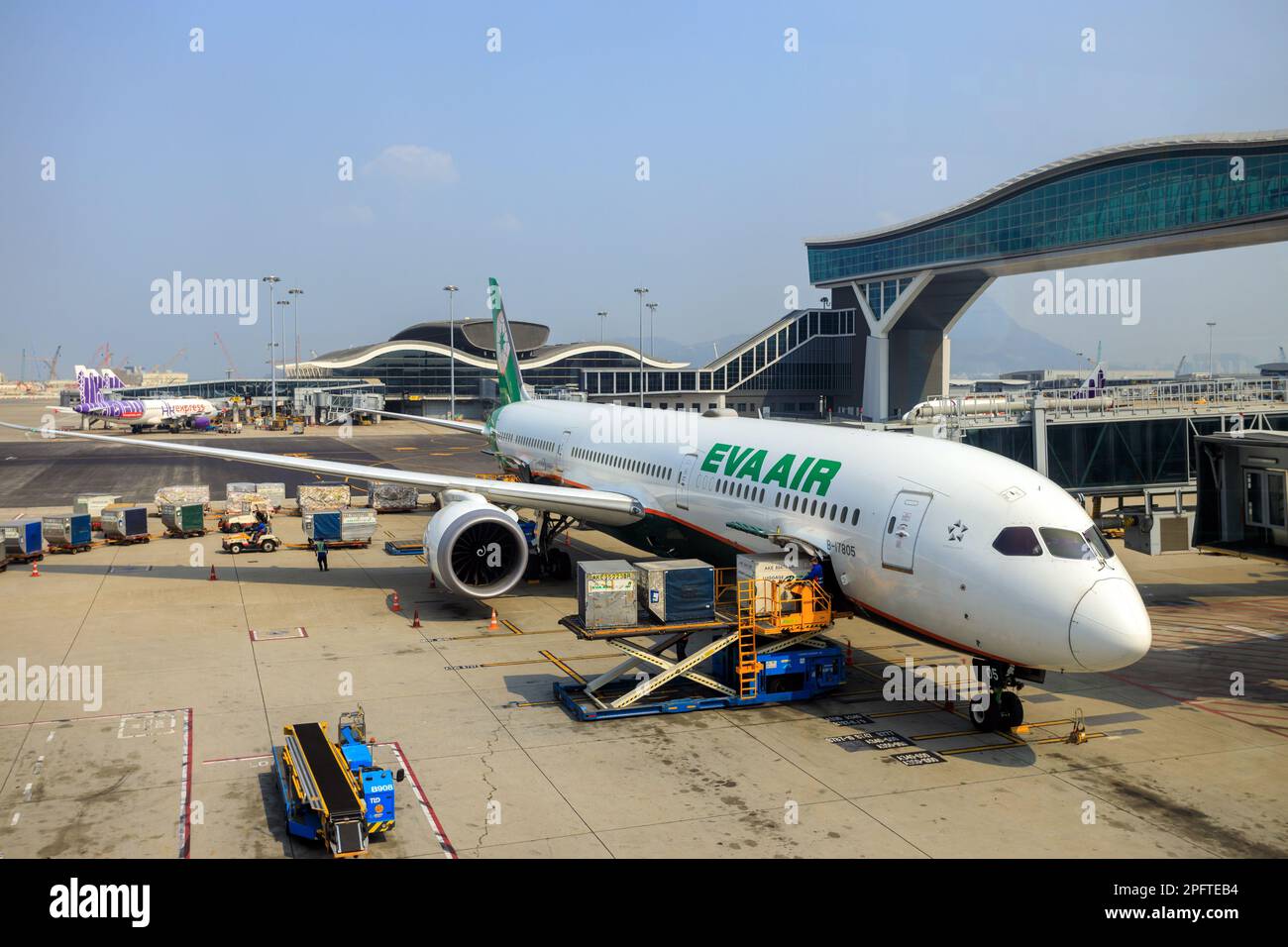 Hong Kong - March 1, 2023: Airplane at boarding gate jet bridge in Hong ...