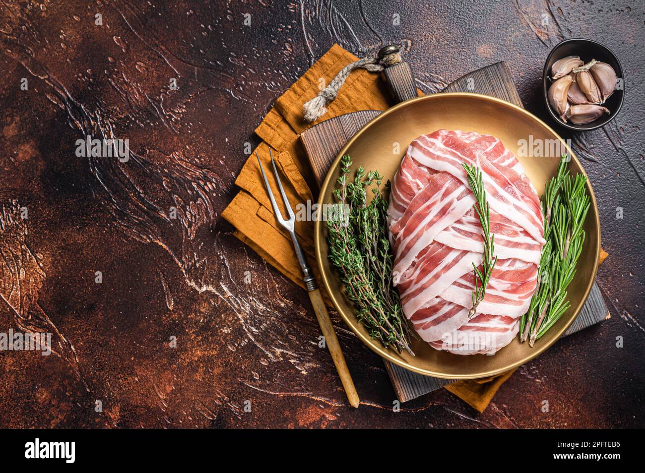 Raw meatloaf with ground beef meat and bacon with herbs and spices ...