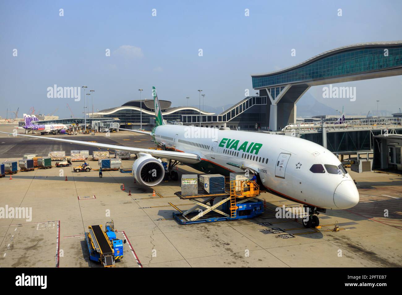 Hong Kong - March 1, 2023: Airplane at boarding gate jet bridge in Hong ...