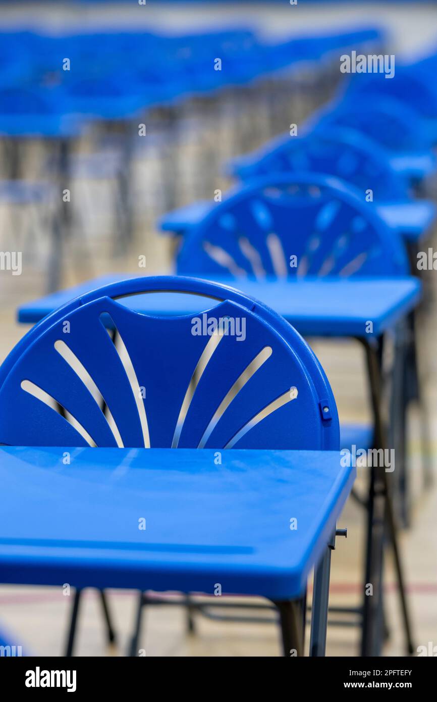 Exam desks laid out in a school hall Stock Photo - Alamy
