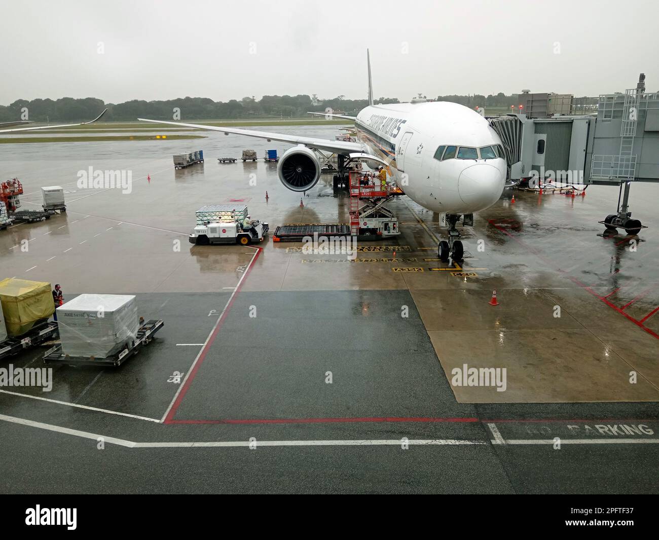 Hong Kong - March 1, 2023: Airplane at boarding gate jet bridge in Hong ...