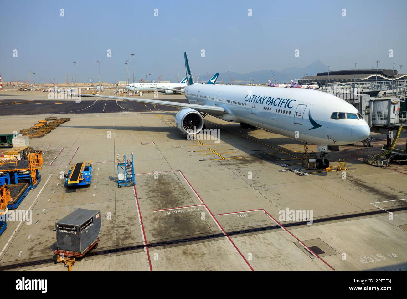 Hong Kong - March 1, 2023: Airplane at boarding gate jet bridge in Hong ...