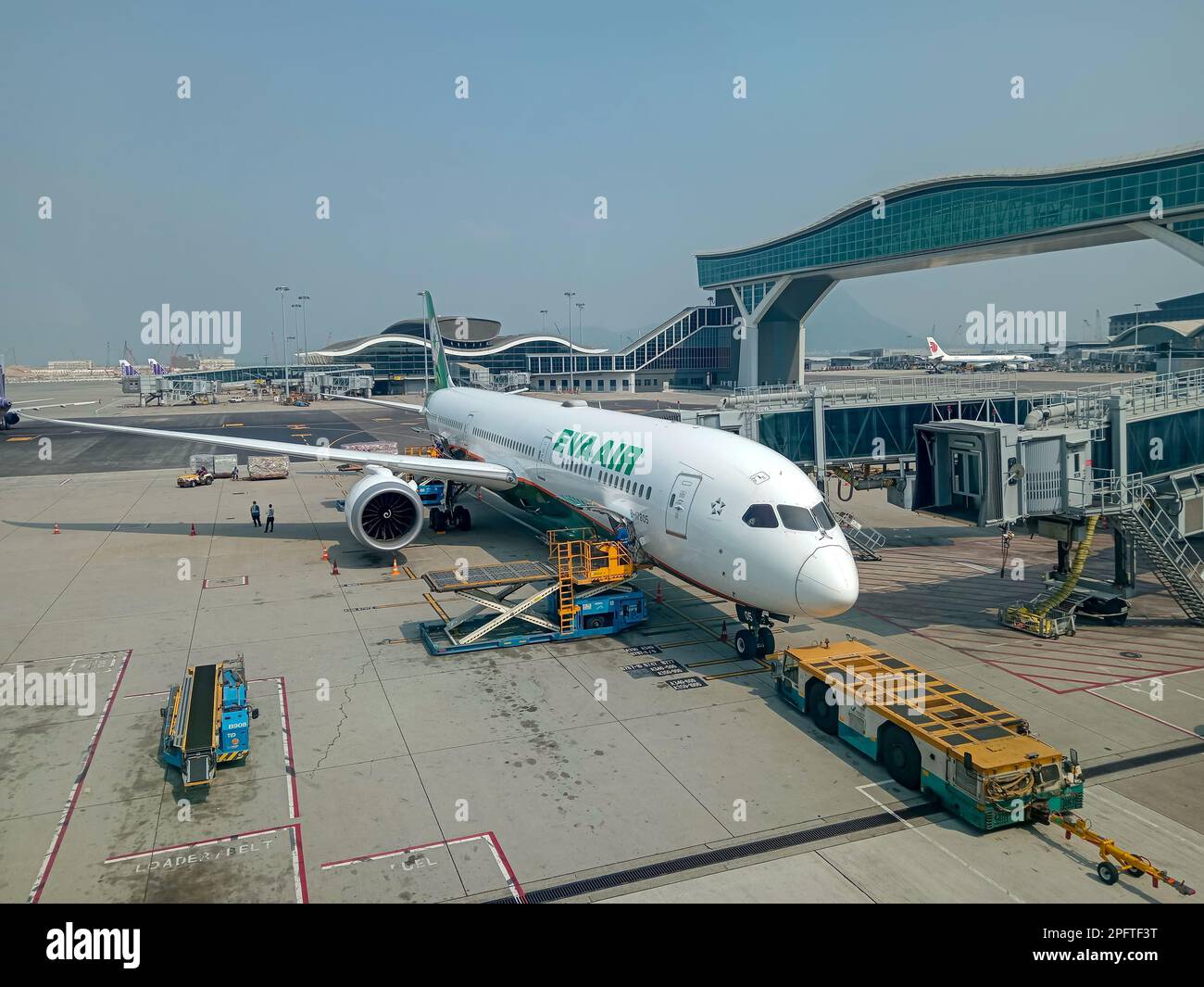 Hong Kong - March 1, 2023: Airplane at boarding gate jet bridge in Hong ...