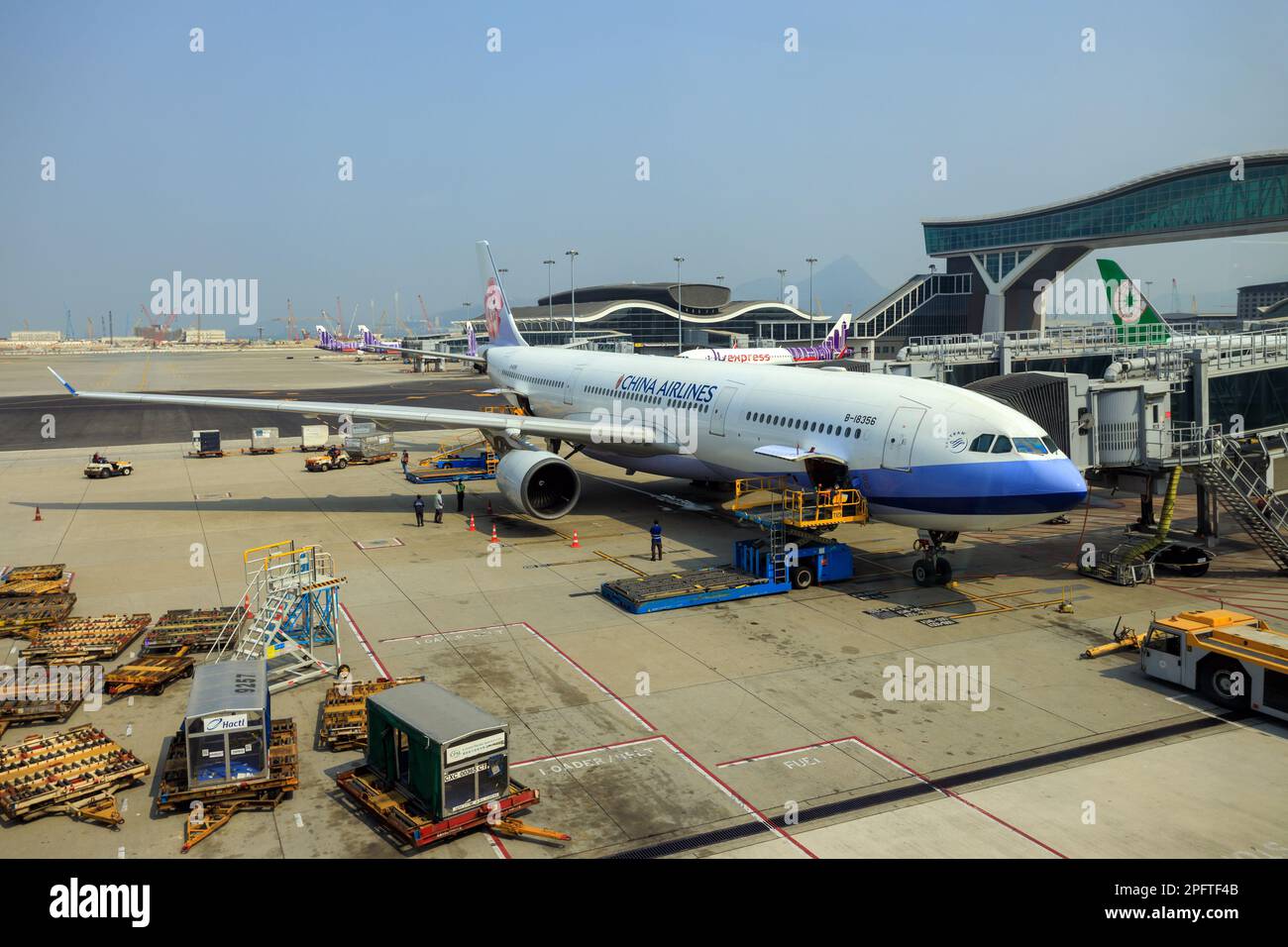 Hong Kong - March 1, 2023: Airplane at boarding gate jet bridge in Hong ...
