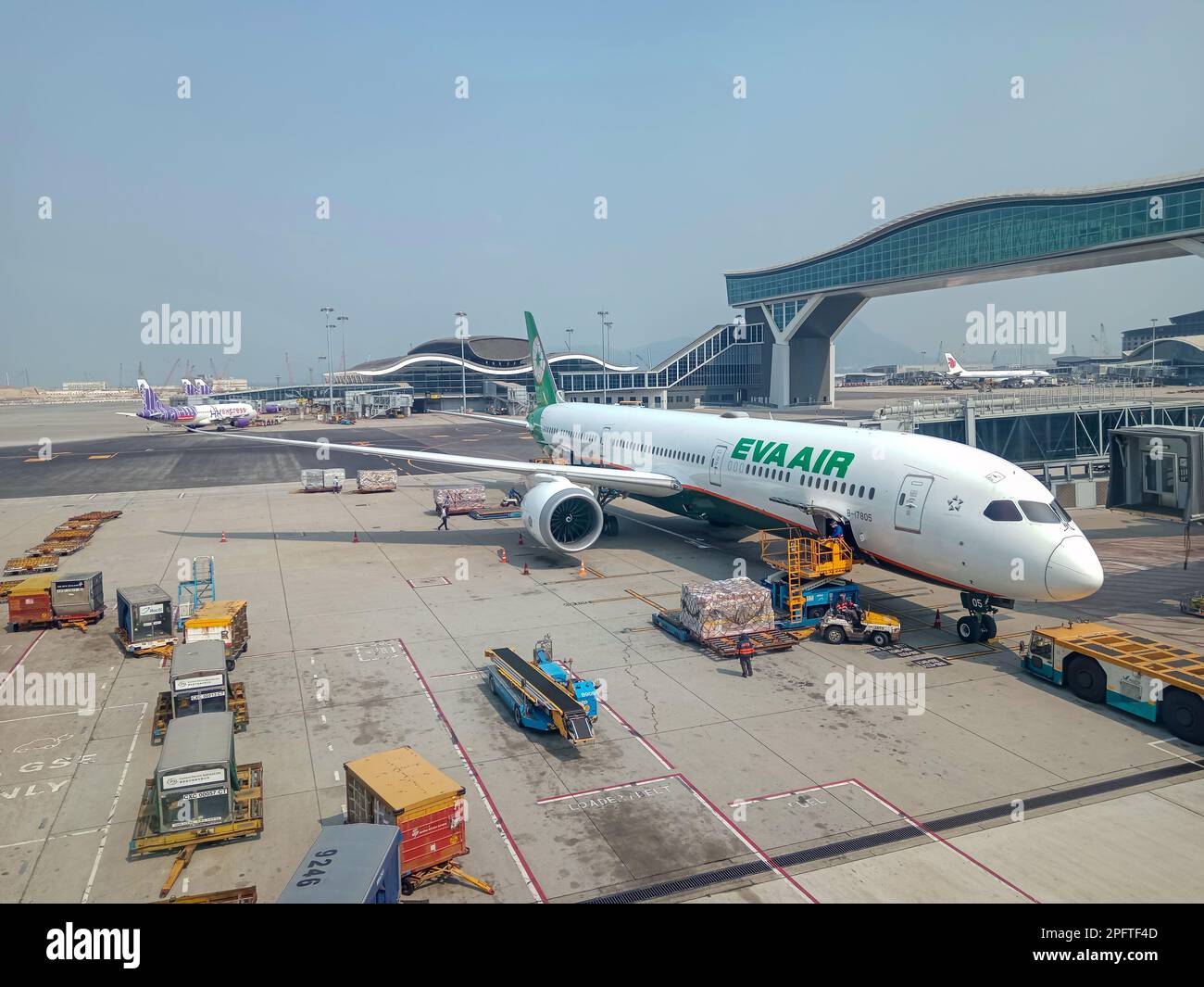 Hong Kong - March 1, 2023: Airplane at boarding gate jet bridge in Hong ...