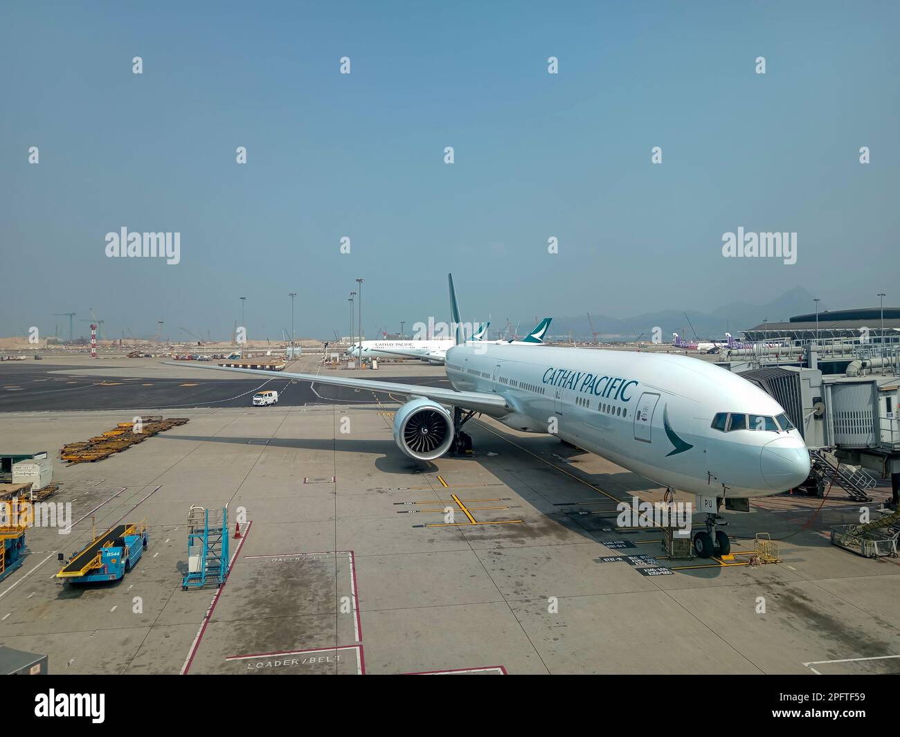 Hong Kong - March 1, 2023: Airplane at boarding gate jet bridge in Hong ...