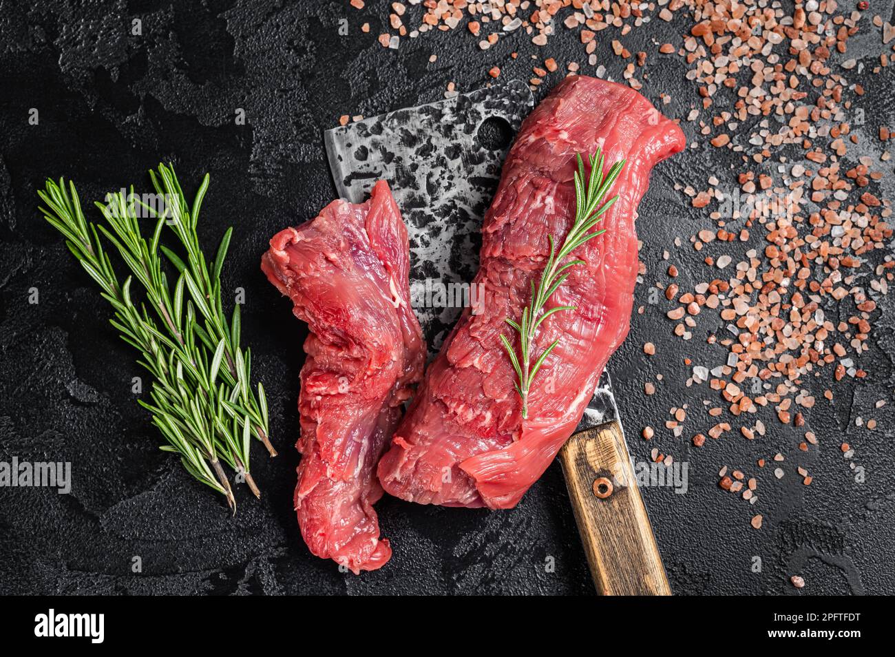 Whole Beef tenderloin meat, raw tender loin on butcher table. Black ...