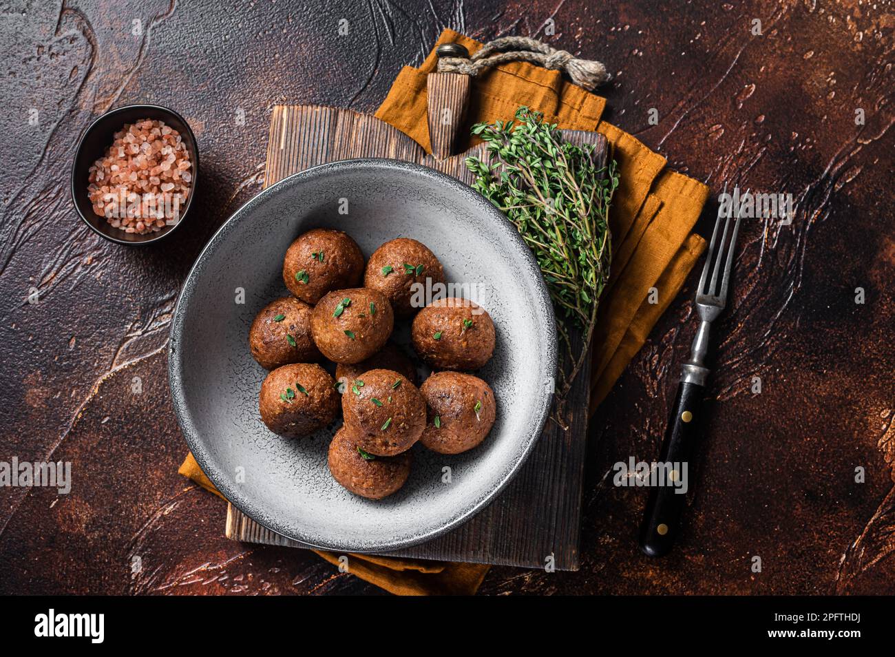Vegetarian meatless Meatballs from plant based meat with herbs. Dark ...