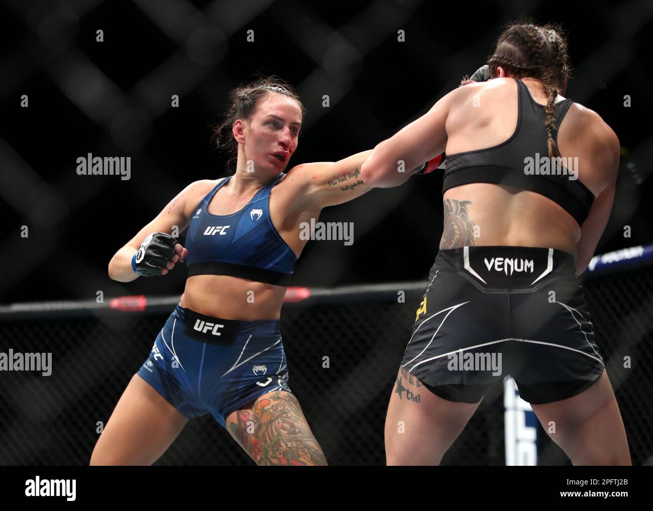 Casey O'Neill (left) and Jennifer Maia in action during their flyweight ...