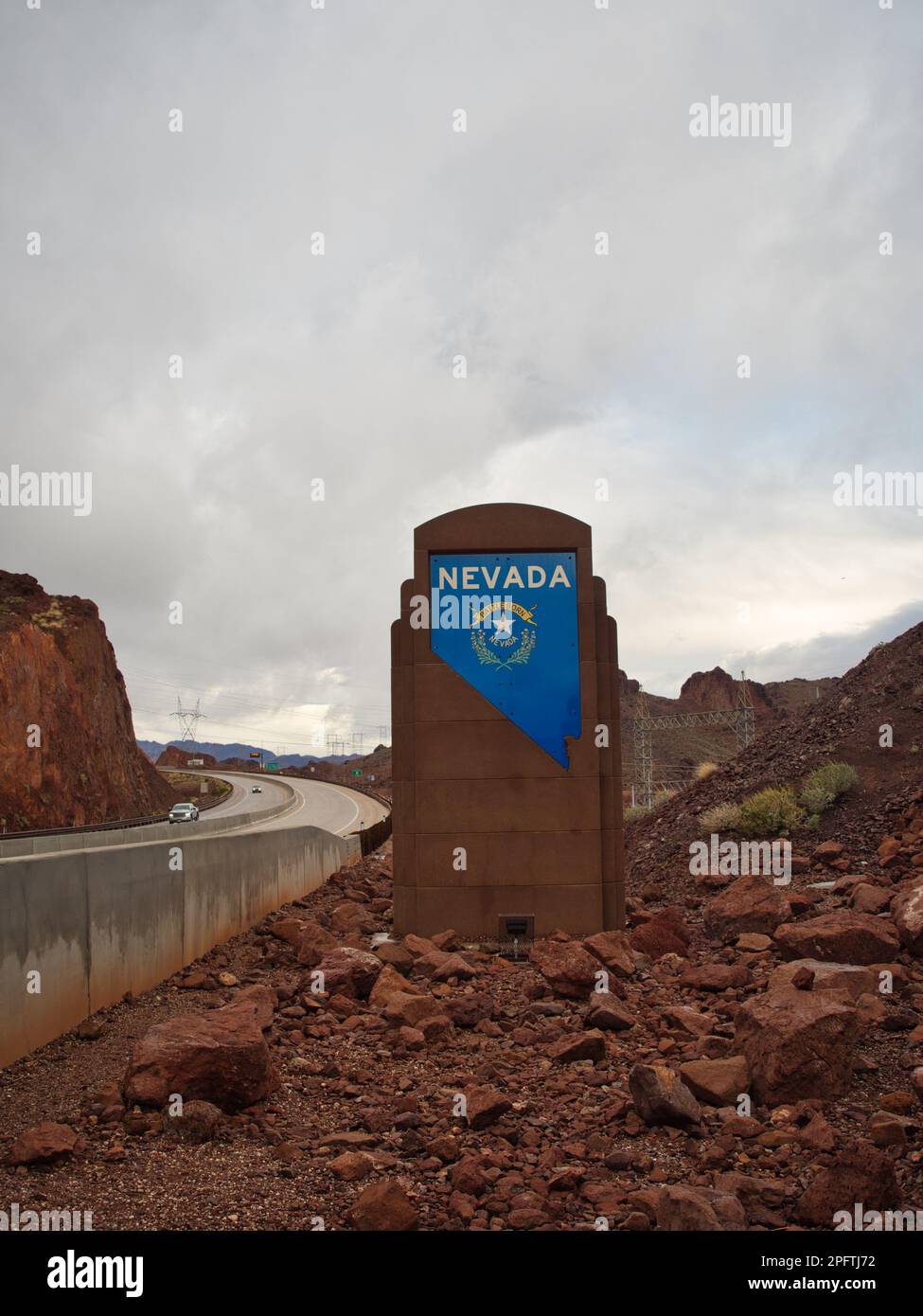 Blue Nevada Welcome Sign on US Highway 93 at the Hoover Dam on a dark ...
