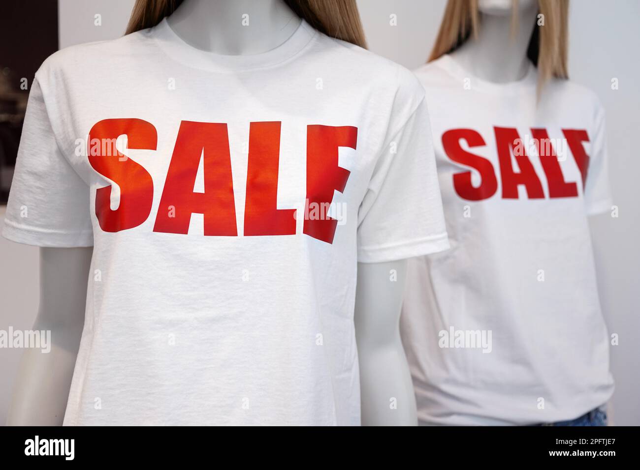 shop window mannequins or dummies advertising summer clearance sale ...