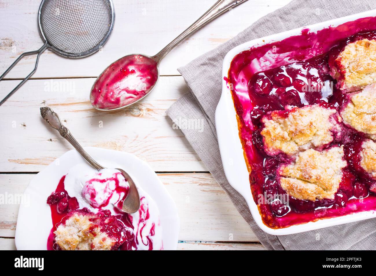 Homemade cherry cobbler pie with flaky crust, ice cream, vintage spoon ...