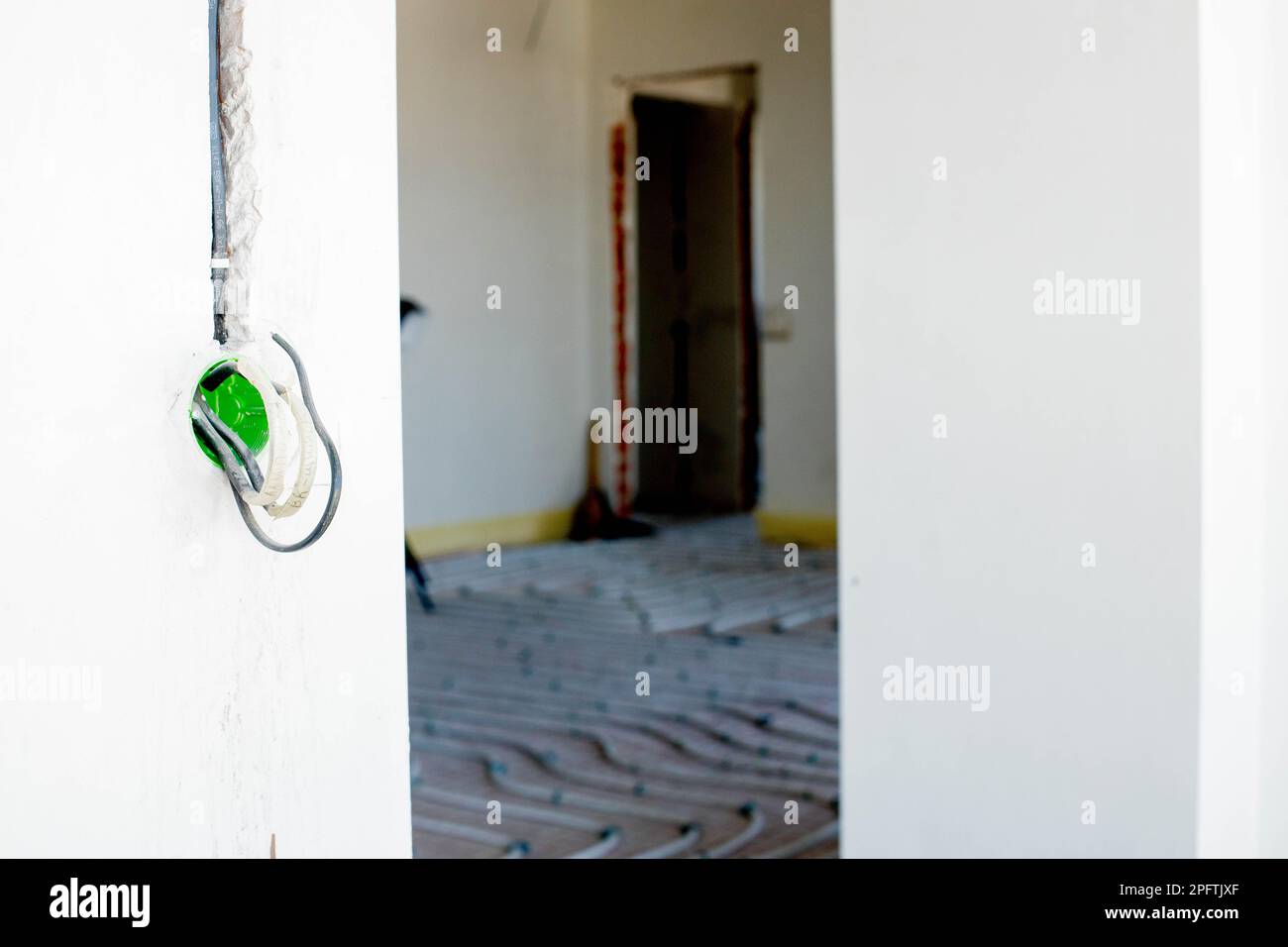 New wiring in plastic box and electrical cables for future wall sockets ...