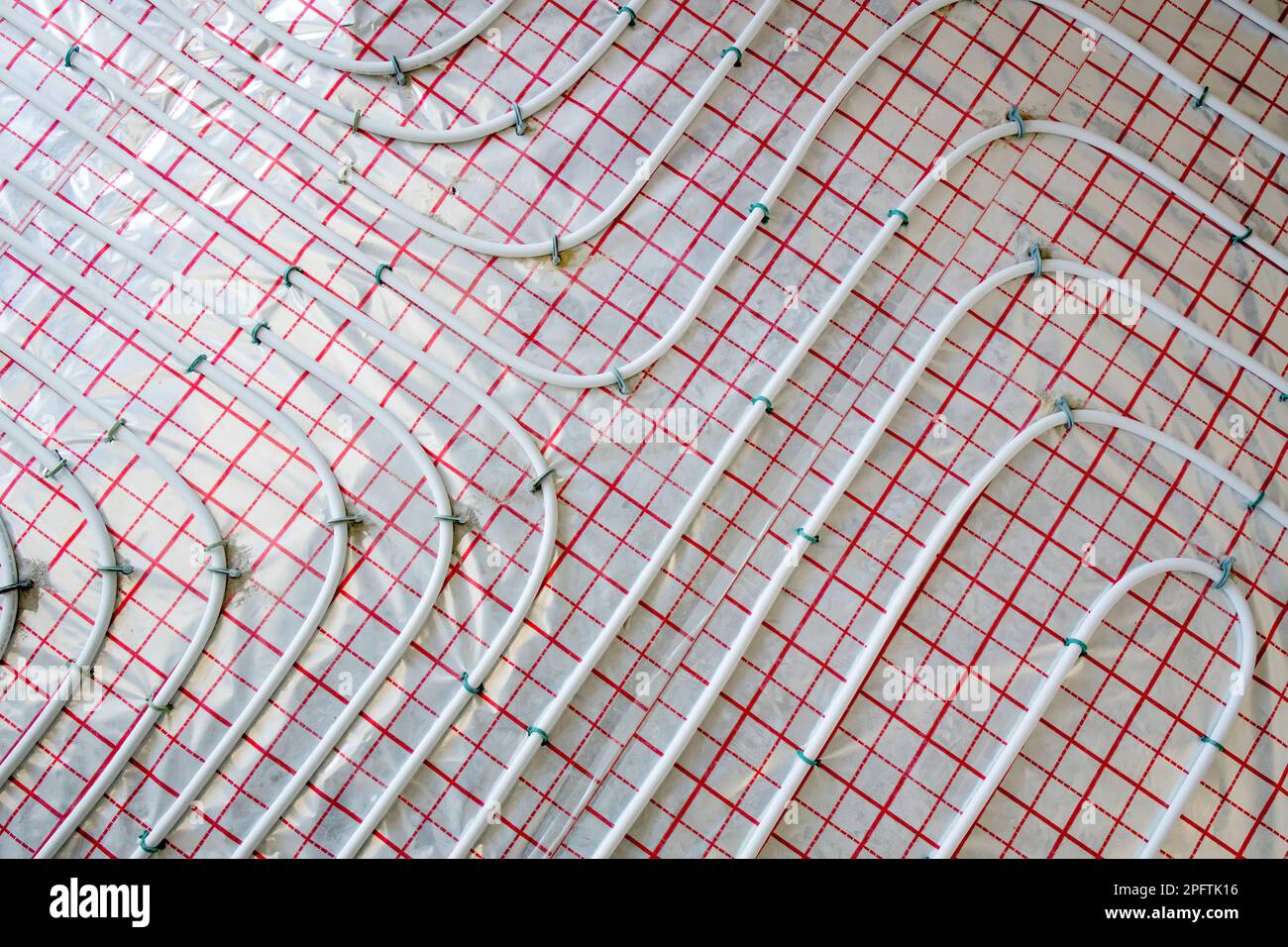 Installation of underfloor heating pipes for water heating. Heating systems. Pipes for ...