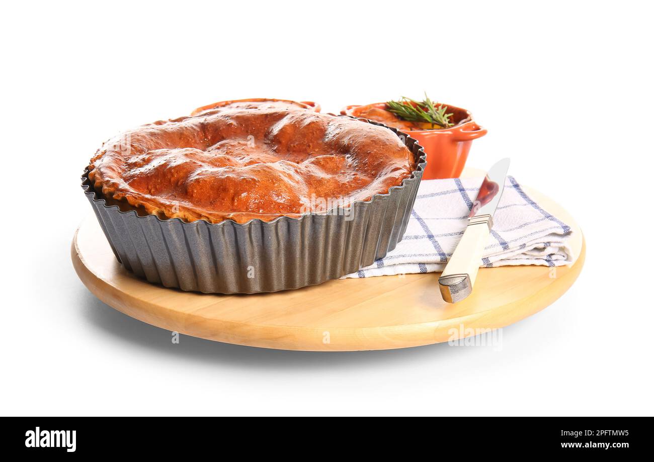 Board with delicious meat pies in baking forms isolated on white ...
