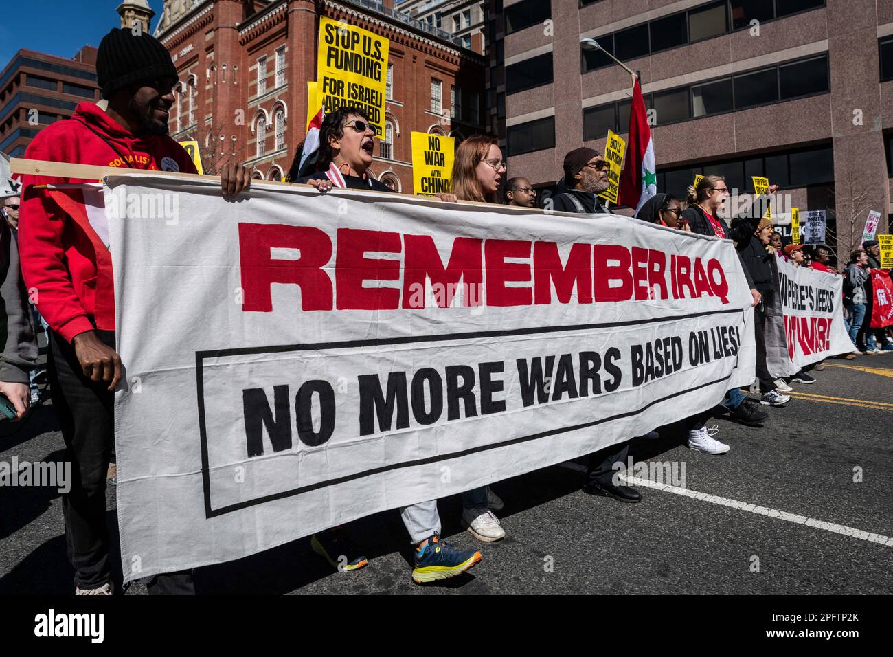 Anti-war protesters march through Washington, DC on March 18, 2023 ...