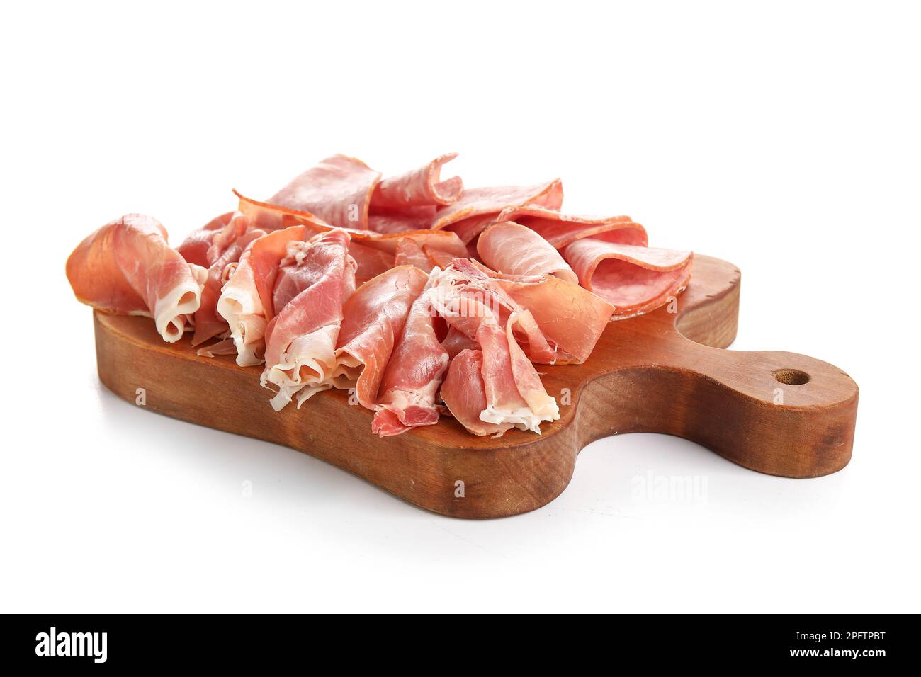 Wooden board with assortment of tasty deli meats isolated on white ...