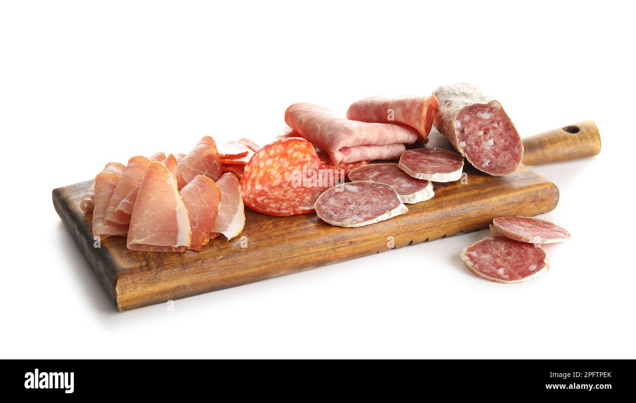 Wooden board with assortment of tasty deli meats isolated on white ...