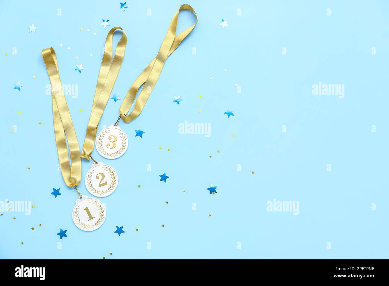 Prize medals with stars on blue background Stock Photo - Alamy