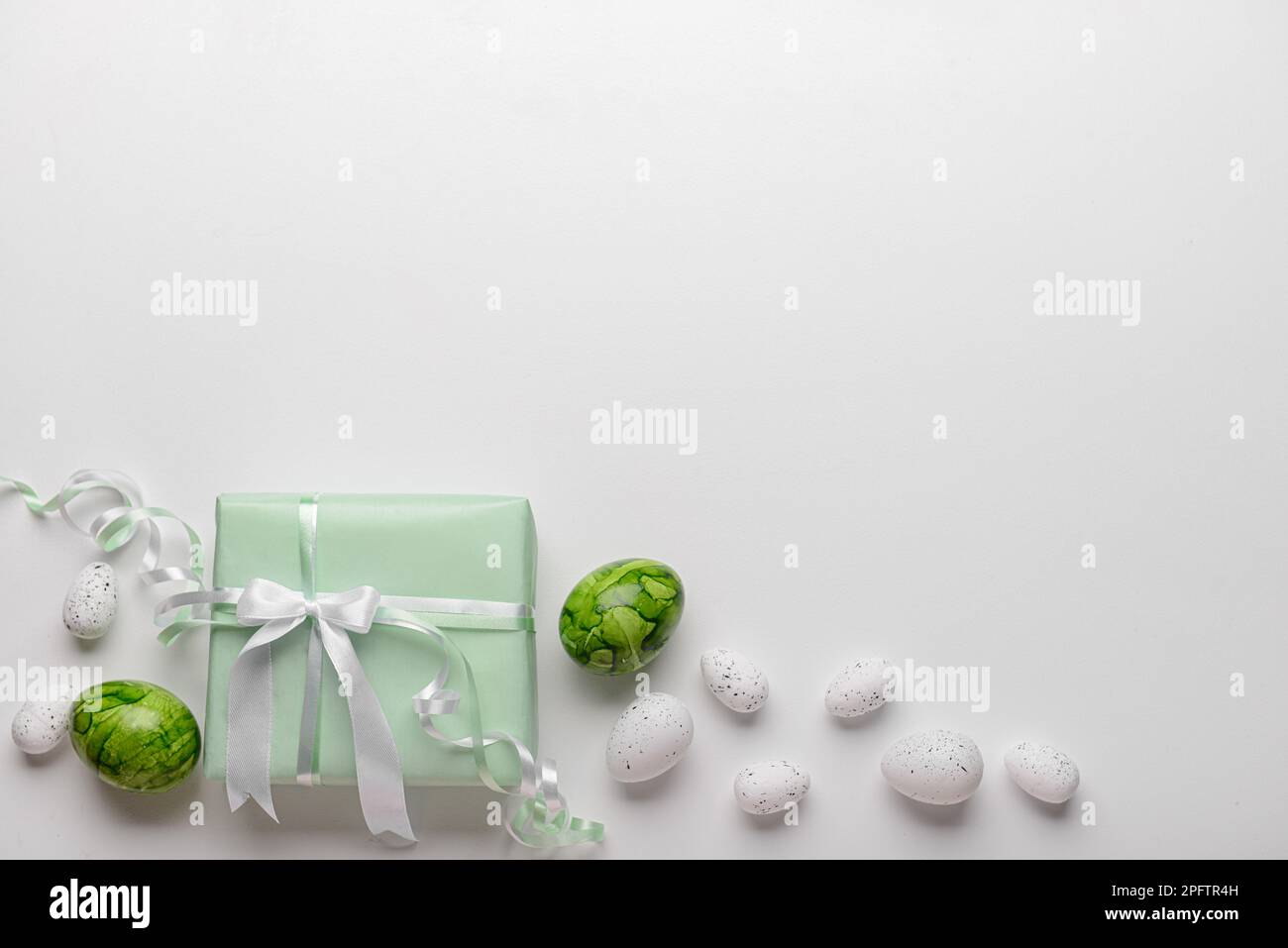 Easter eggs and gift box on white background Stock Photo - Alamy