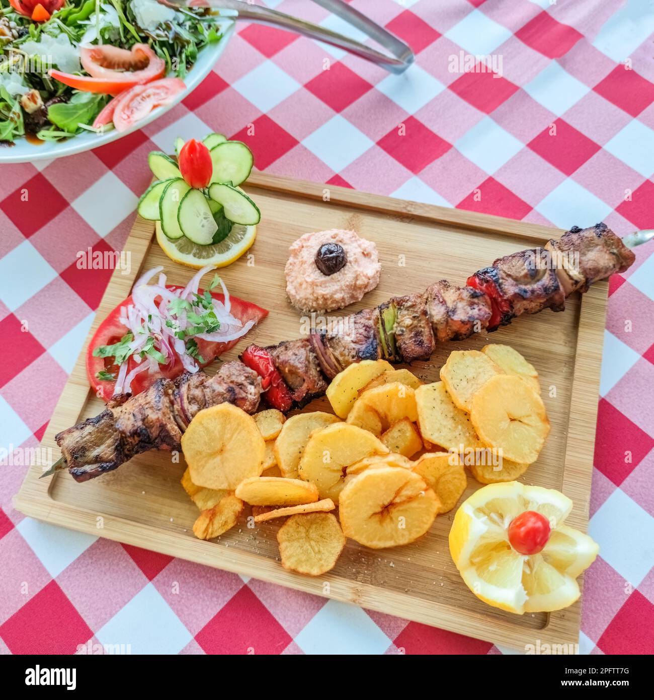 Greek kontosouvli large souvlaki made by fresh meat grilled on fire and ...