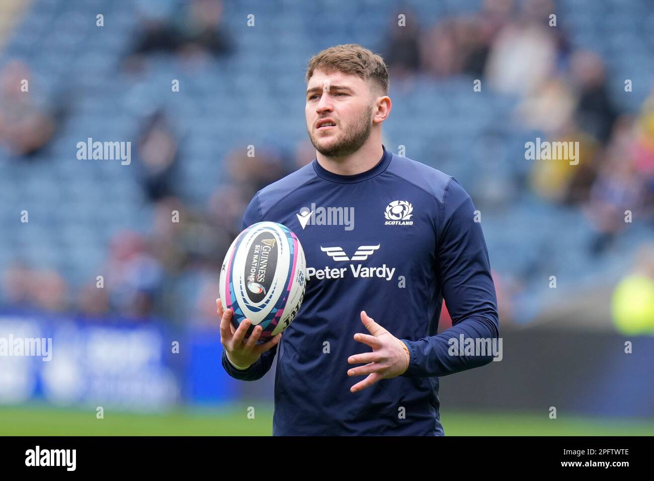 Edinburgh, UK. 18th Mar, 2023. Ollie Smith #15 of Scotland warms up ...