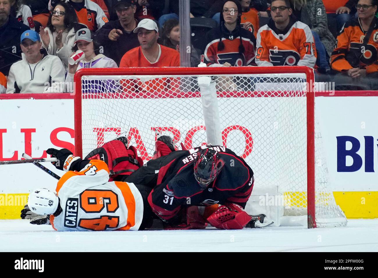 Philadelphia Flyers' Noah Cates (49) collides with Carolina Hurricanes ...