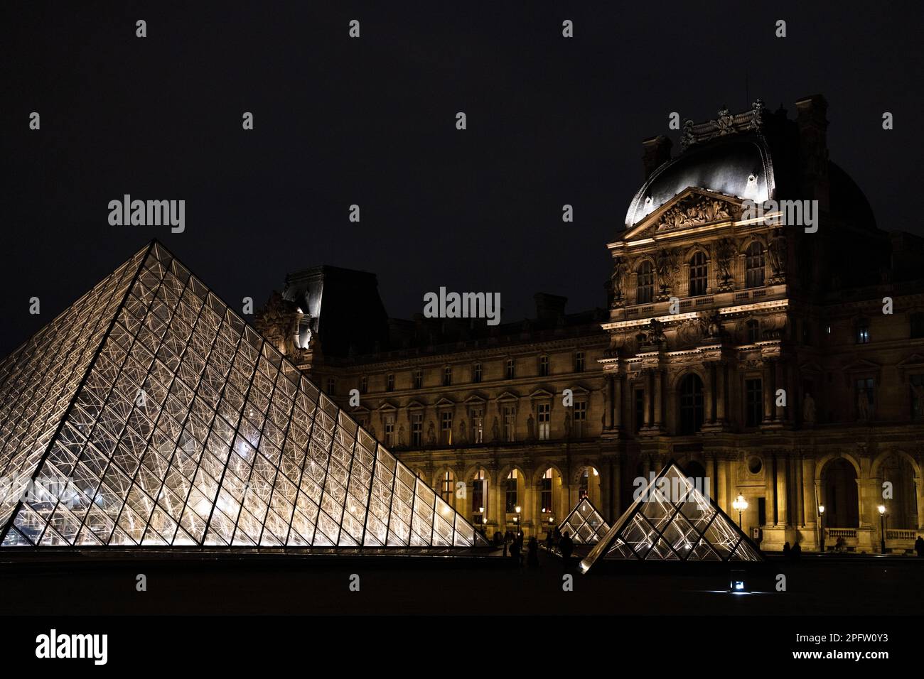 Louvre Pyramids at Night Stock Photo - Alamy