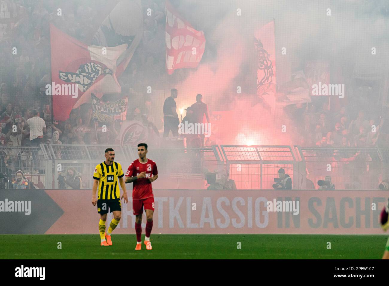 Germany. 18th Mar, 2023. Cologne fans ignite fireworks, pyrotechnics ...