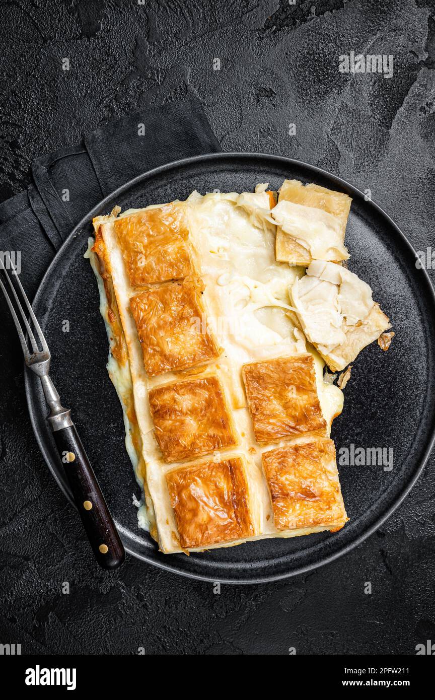 Turkish Su Boregi pie, Tabla borek or burek in plate. Black background ...