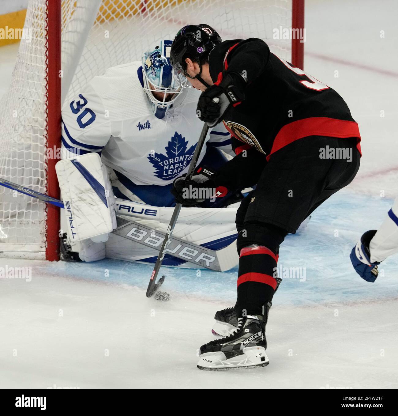 Ottawa Senators center Shane Pinto tries to move the puck past Toronto ...