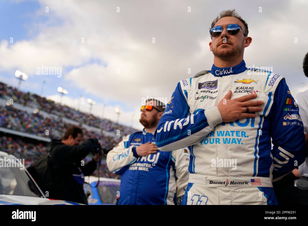 DANIEL HEMRIC (11) stands for the national anthem before the Beef. It's ...