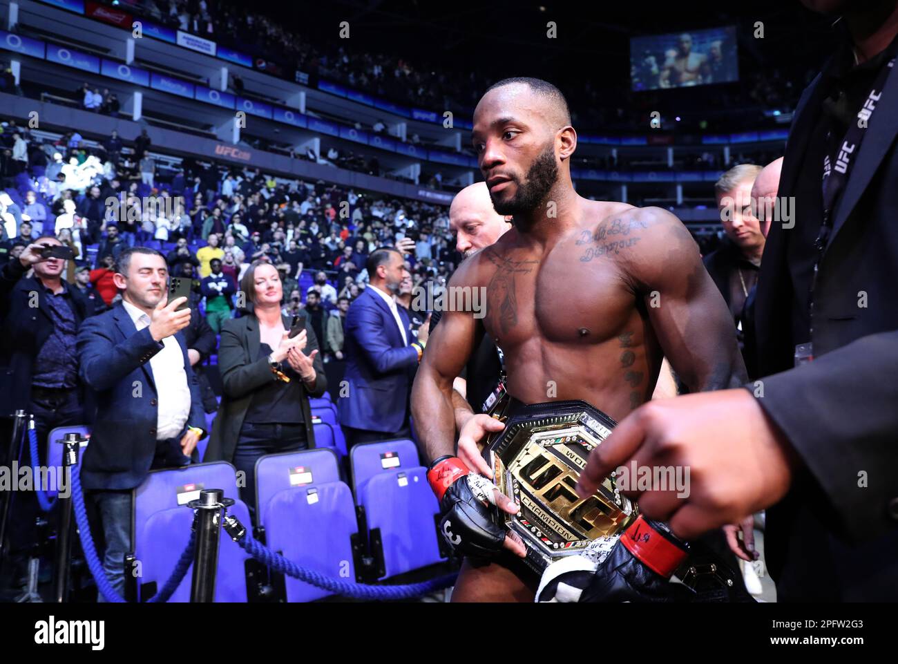 Leon Edwards leaves the Octagon after victory against Kamaru Usman ...