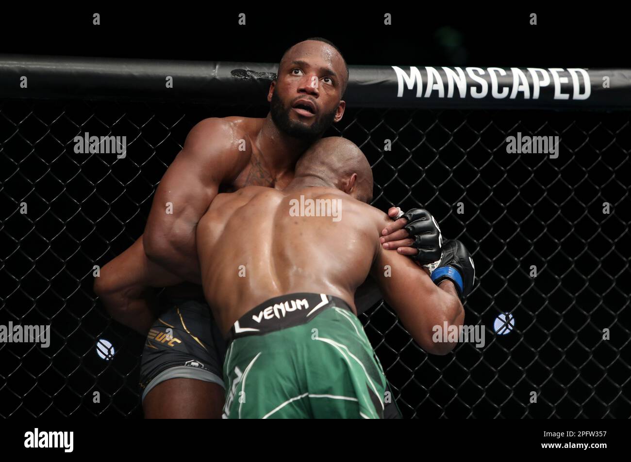 Leon Edwards (right) in action against Kamaru Usman during their ...
