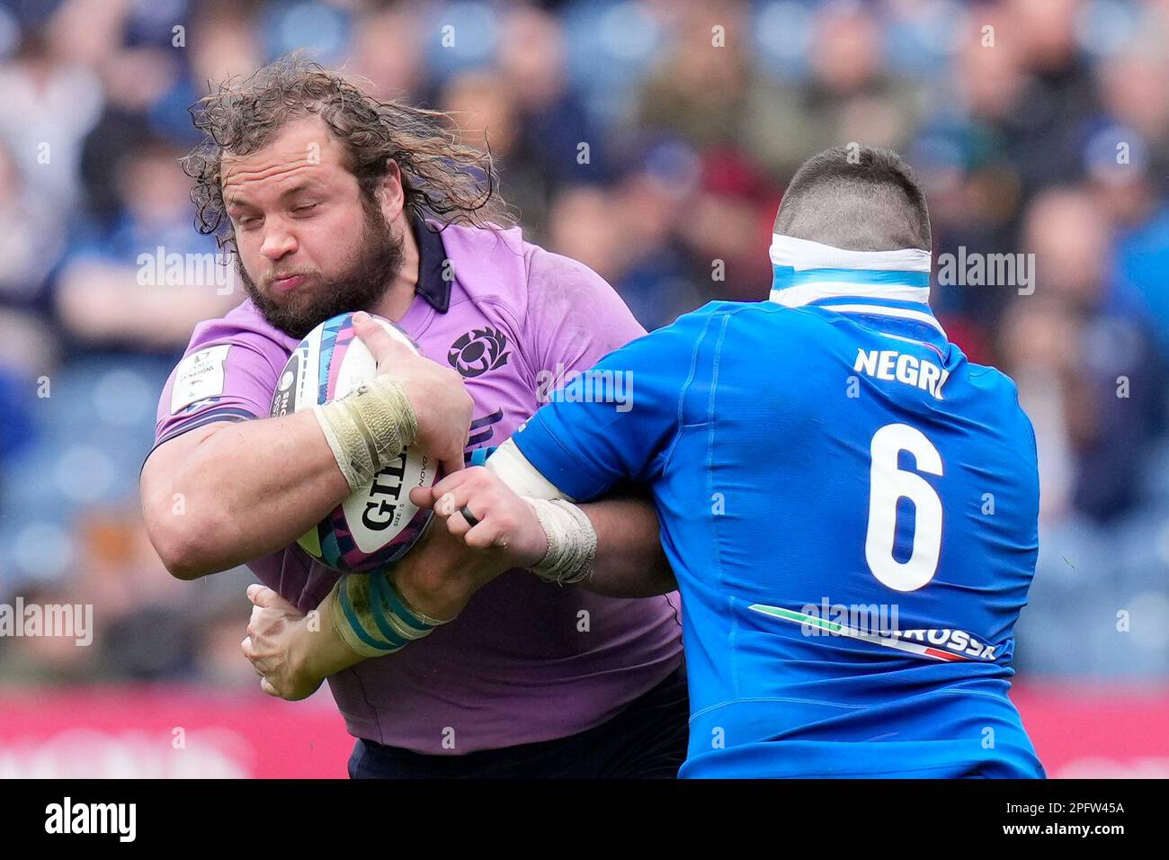 Pierre Schoeman #1 of Scotland is held by Sebastian Negri #6 of Italy ...