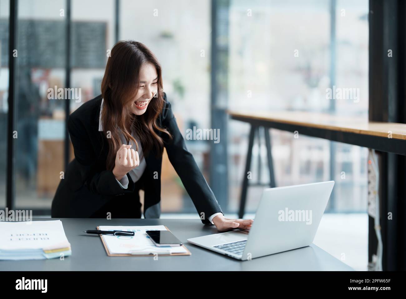 Portrait of a woman business owner showing a happy smiling face as he ...