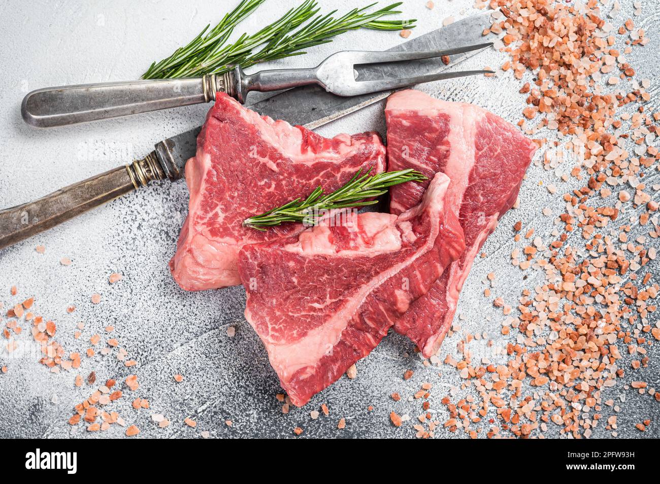 Silverside sirloin beef cut, raw meat on butcher table with herbs ...